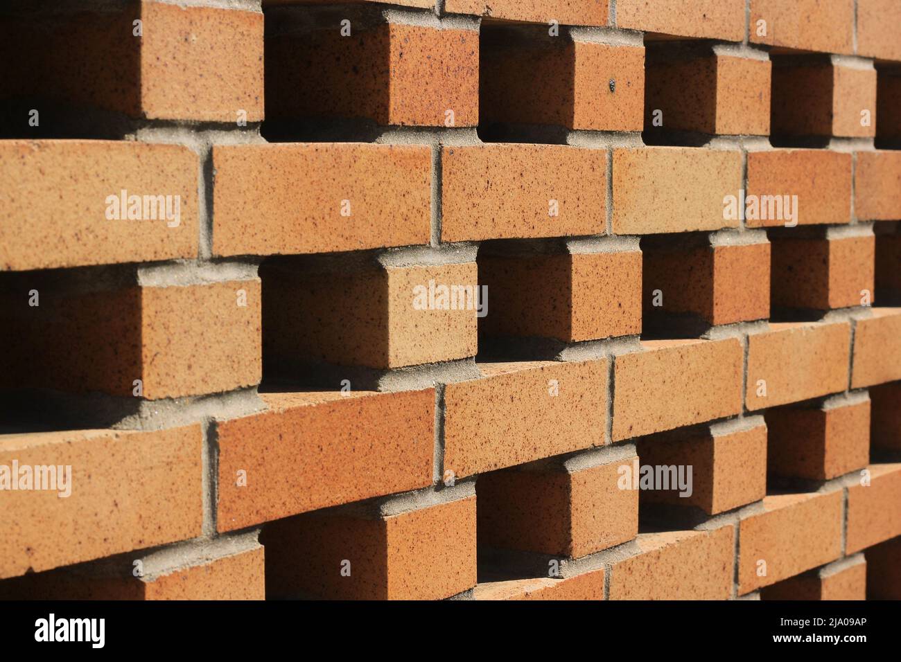 Brick wall with a repeating pattern and openings Stock Photo - Alamy