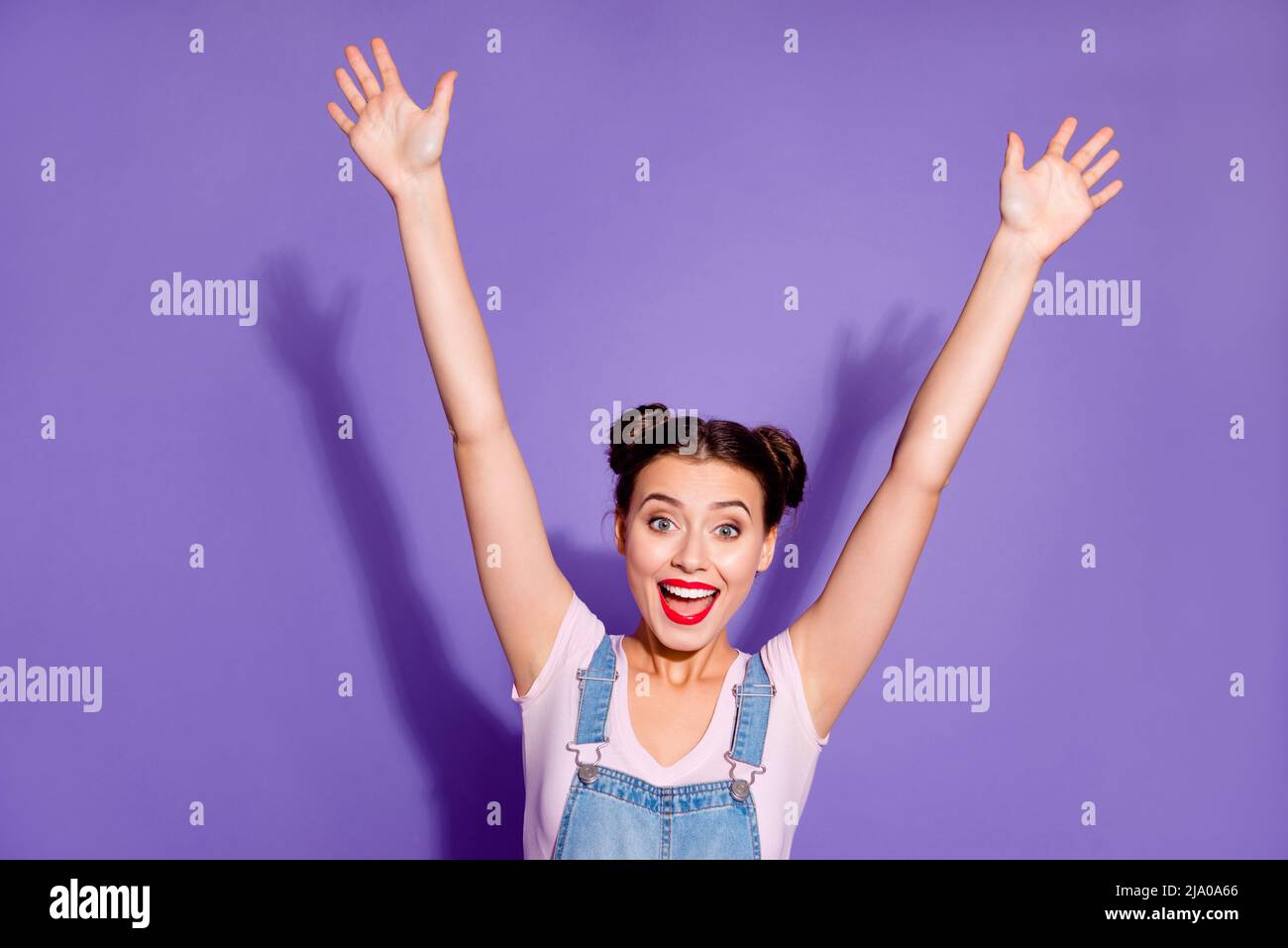 Portrait of pretty overjoyed person raise hands have good mood toothy ...