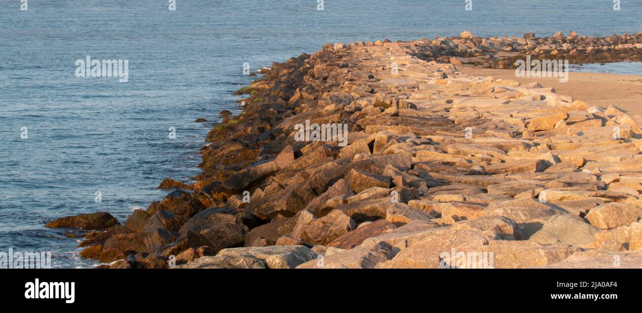 Large rock fishing jetty extending into ocean at camp cronin in Rhode ...
