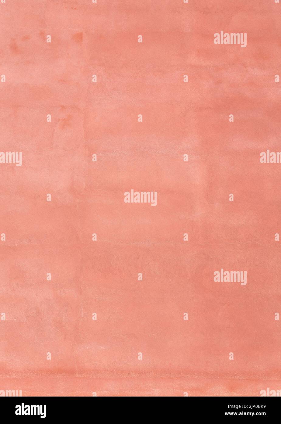 Plastered, weathered and painted pinkish, reddish peach colored ...