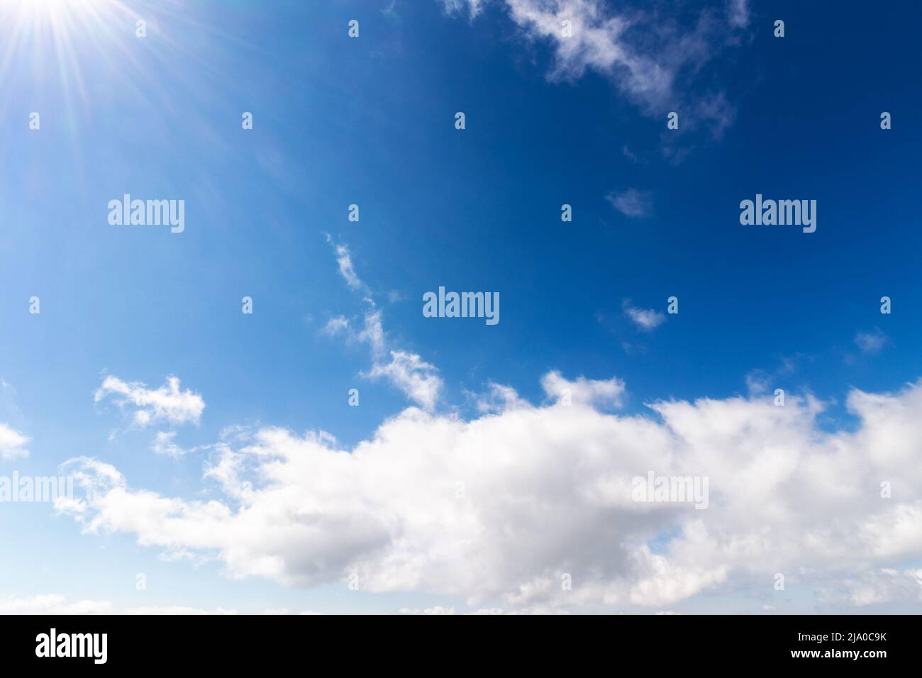 blue sky background. white fluffy clouds above horizon. sunny summer ...