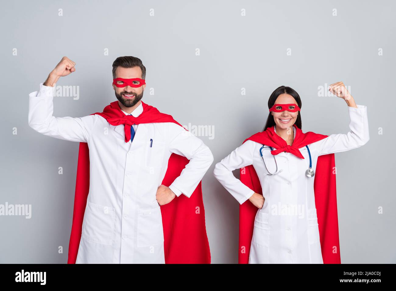 Portrait of two attractive cheerful successful docs super team ready ...