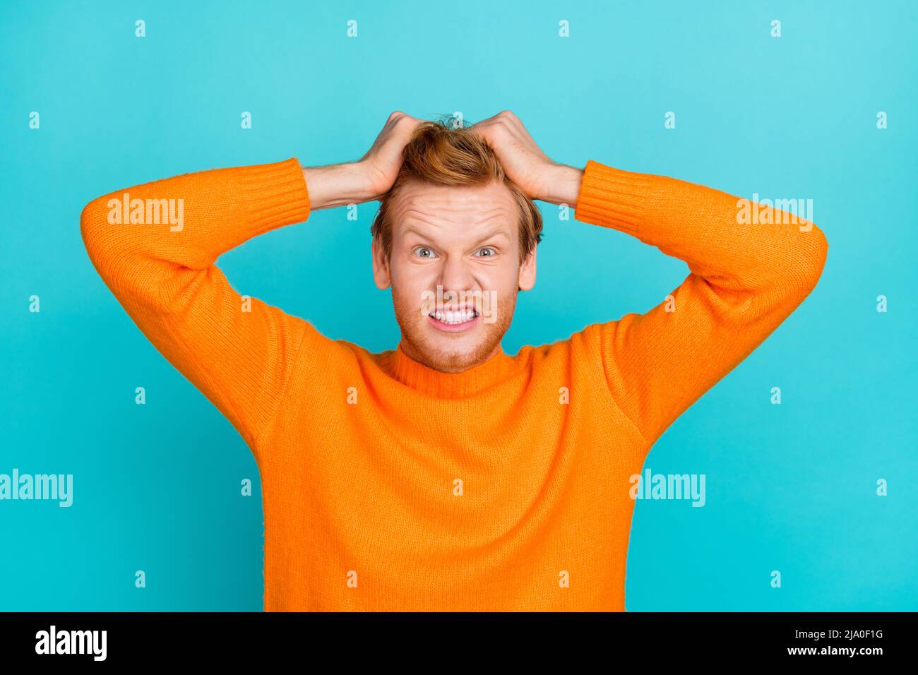 Photo of angry furious guy dressed orange sweater arms hands hairdo ...