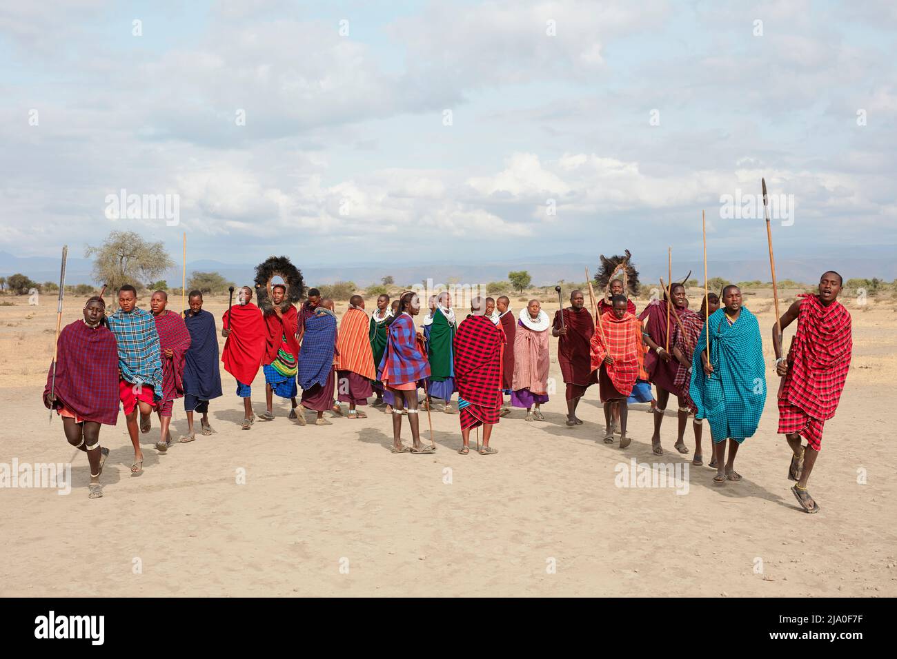 A colorful group of Maasai dancing in a small village near Arusha ...
