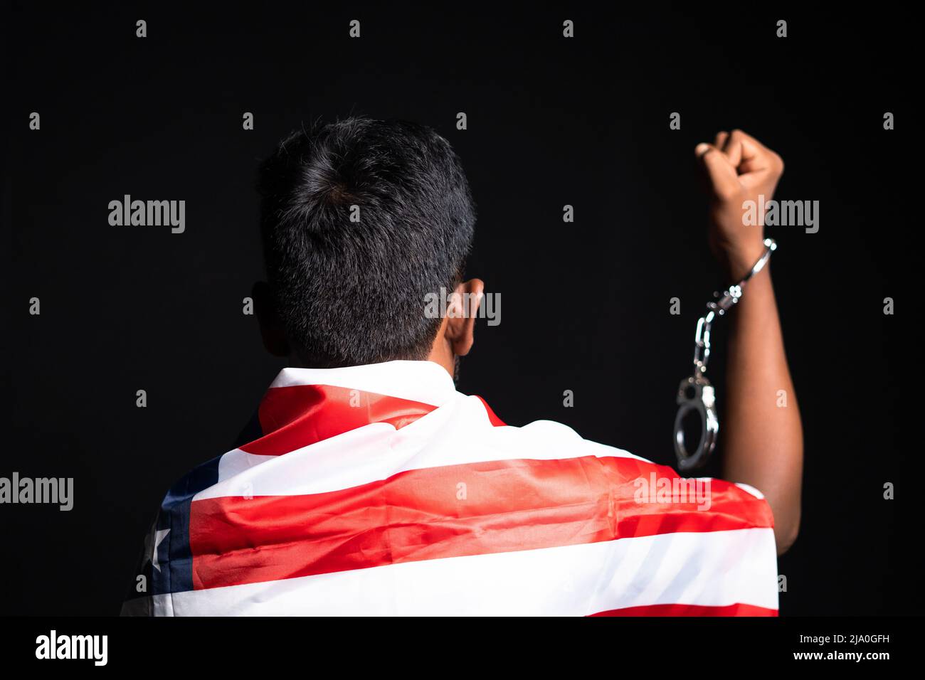 back view shot of man with us or american flag on shoulder showing ...