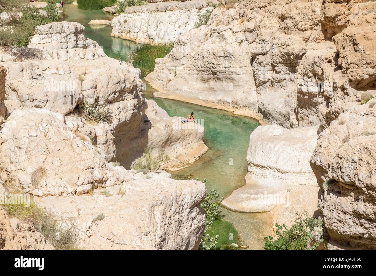 Famous of its vertical cliffs and the green water, Wadi Shab is one of ...