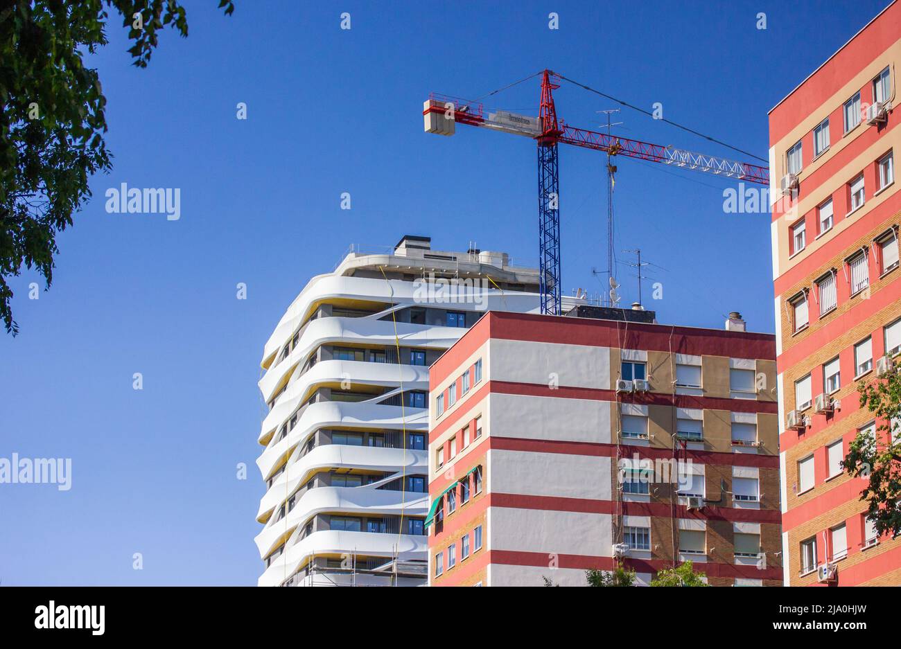 Madrid, Spain. May 1, 2022. Modern white building on construction site ...