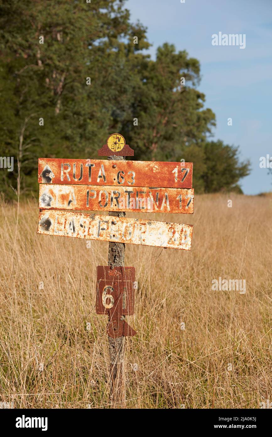 Rusty road signs along a dirt road in the Argentine pampas, near Las ...