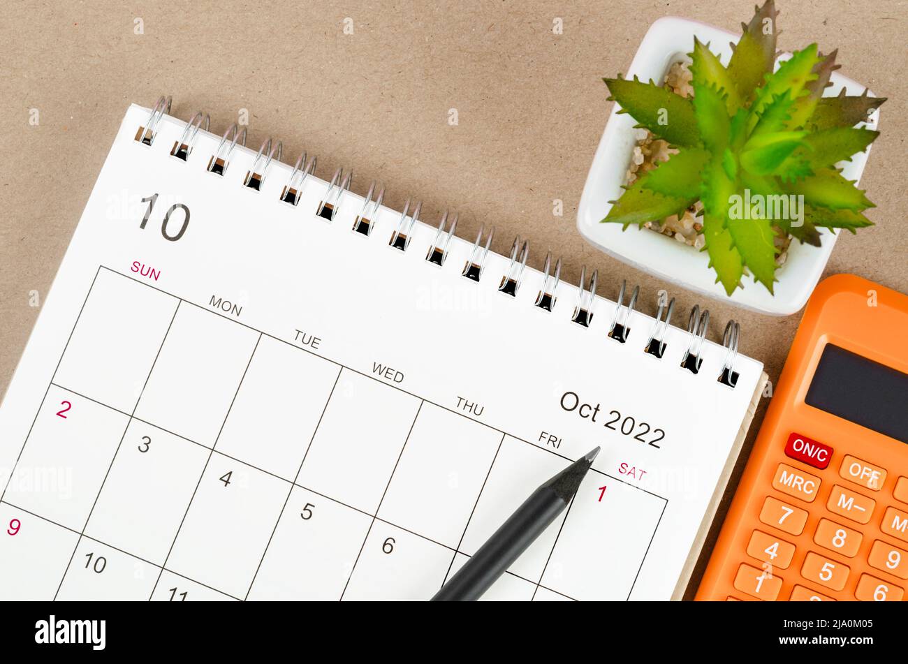 The October 2022 desk calendar with calculator Stock Photo - Alamy