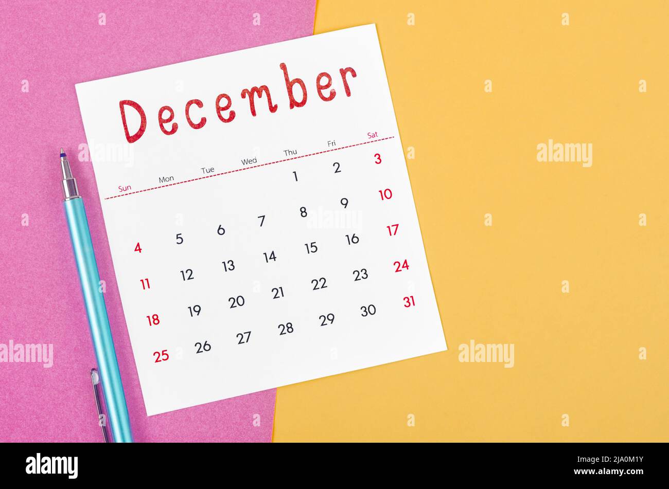 The December 2022 calendar with pen on multicolored background Stock ...