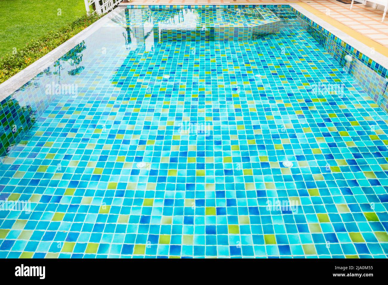 The Macro from Swimming pool with clear blue water in a garden area ...