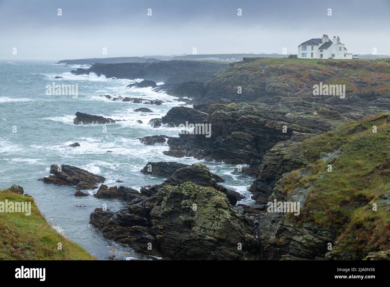 A remote house setting above the rocky coast near ravens point anglesey ...
