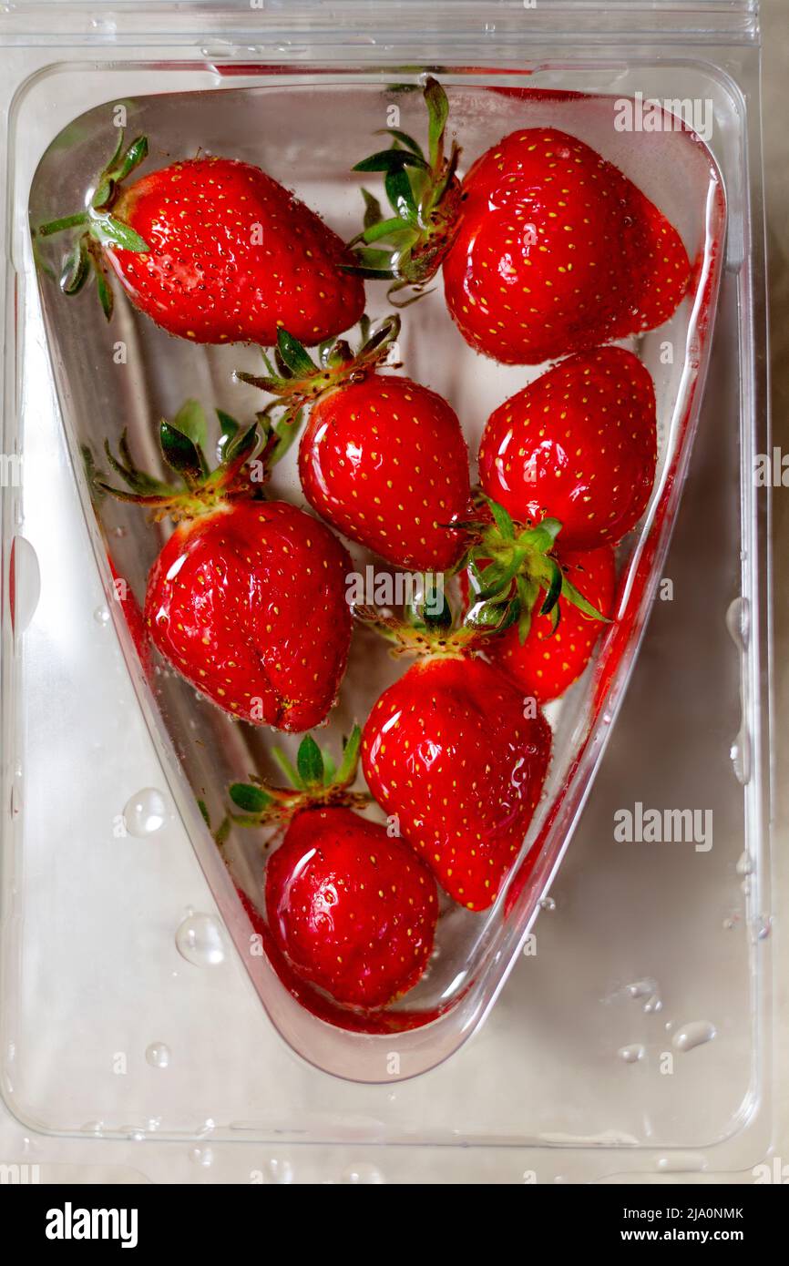 Strawberries with tails hi-res stock photography and images - Alamy