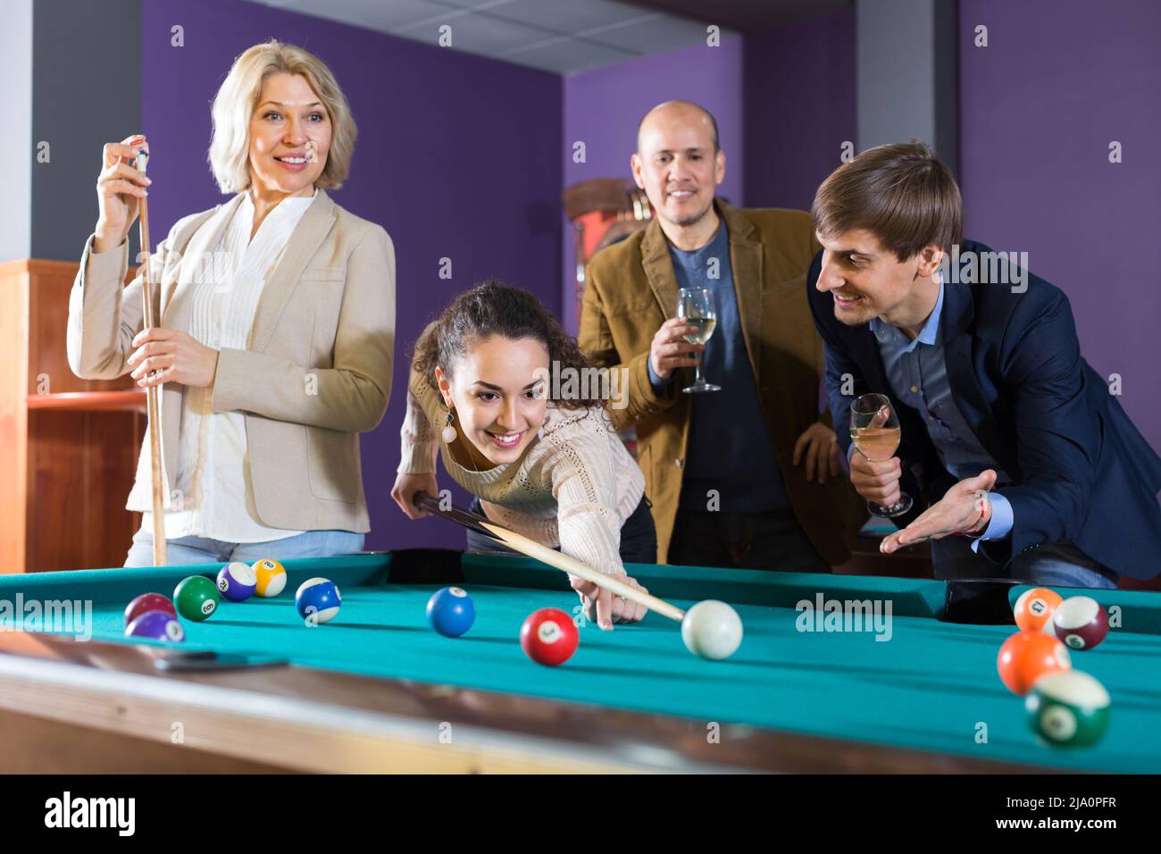 Group of adults playing pool Stock Photo - Alamy