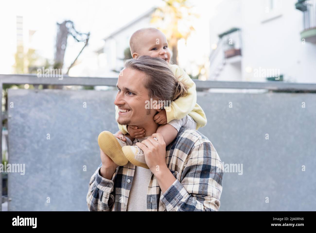 Baby girl sitting on father shoulders hi-res stock photography and ...