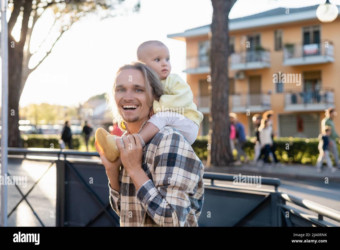 Man carrying baby on back hi-res stock photography and images - Alamy