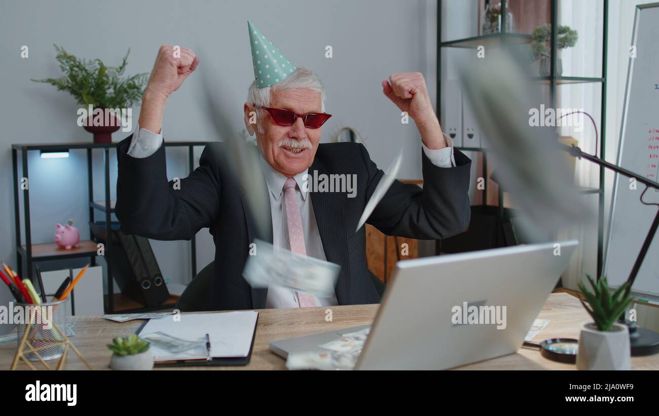 Senior rich businessman dancing celebrate win enjoying wealth lots of ...