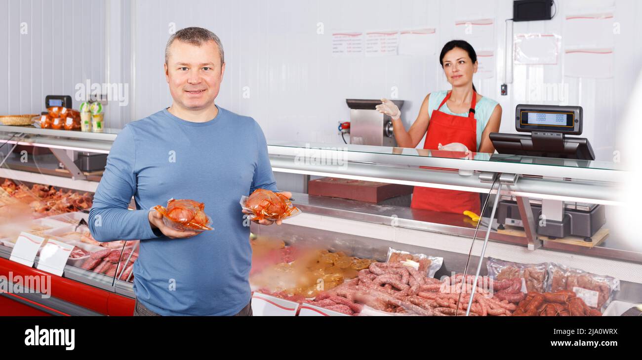 male customer posing in butcher’s shop Stock Photo - Alamy