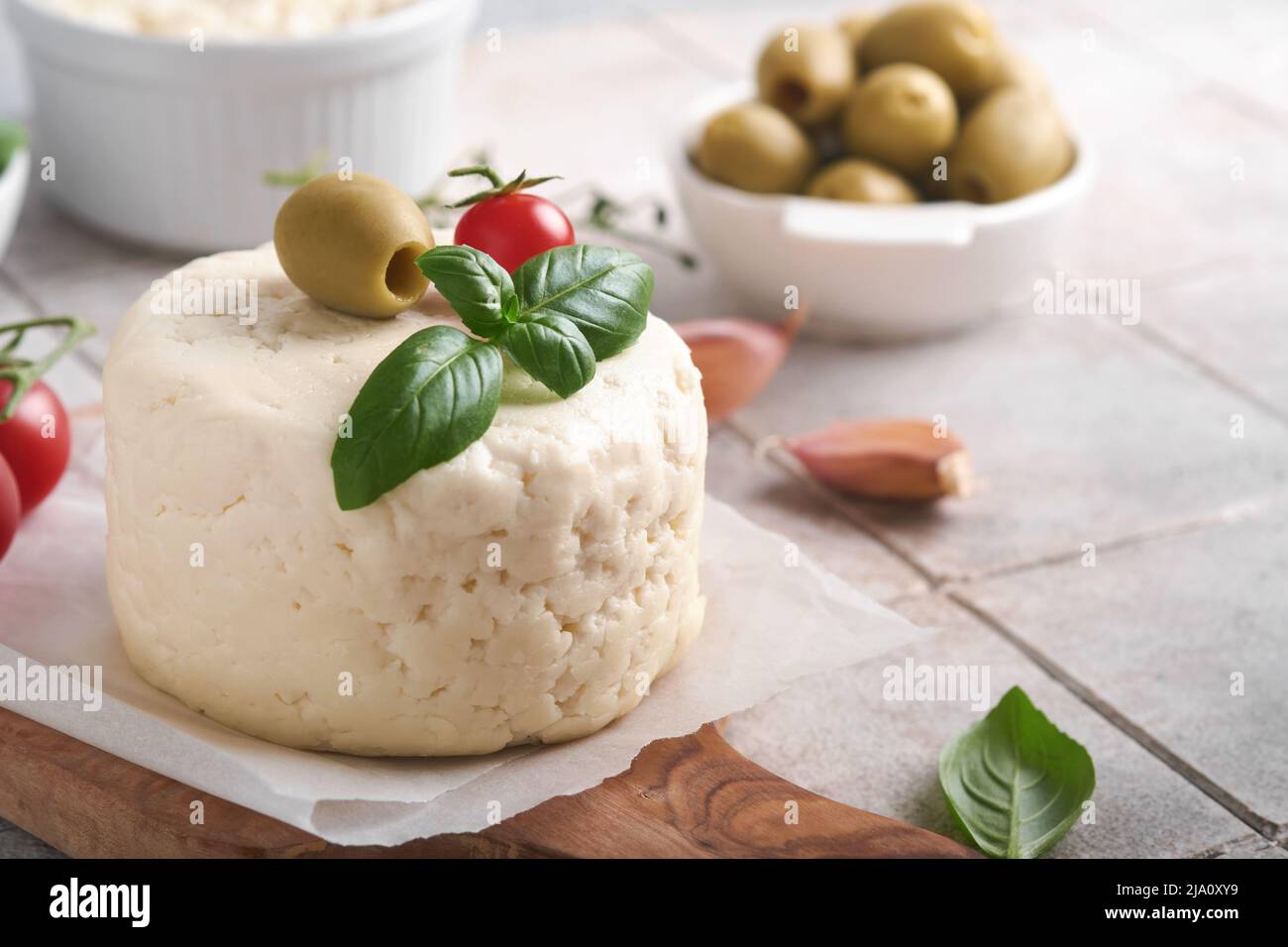Ricotta cheese. Homemade Ricotta cheese with basil, garlic, tomatoes ...