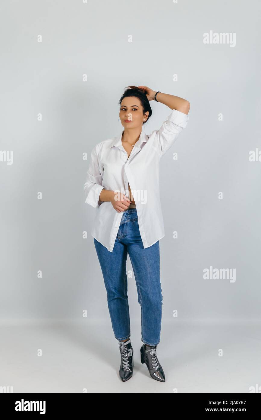 beautiful female model in a white shirt photo in the studio Stock Photo ...