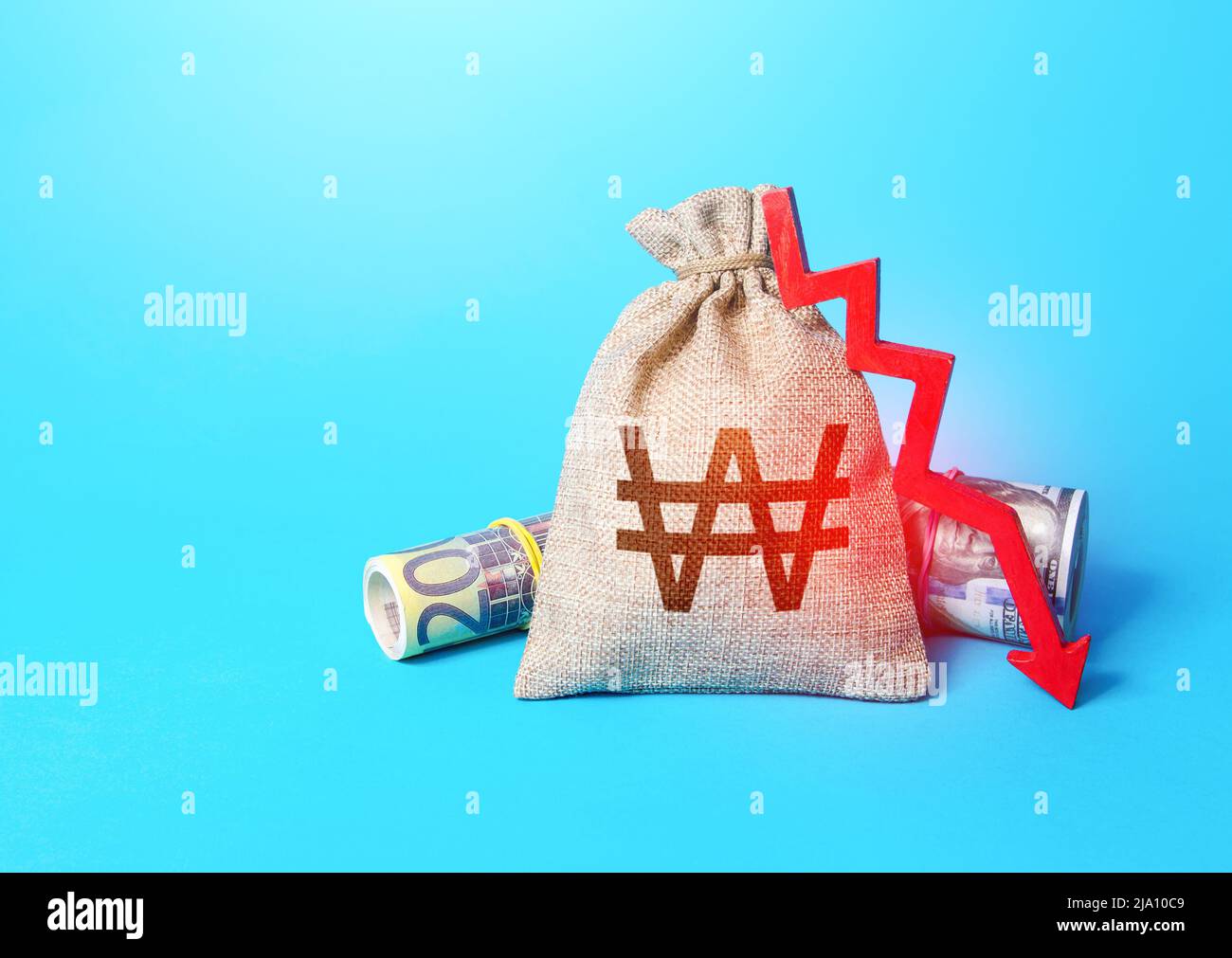 South korean won money bag and arrow down. Drop in profits. Decrease in ...