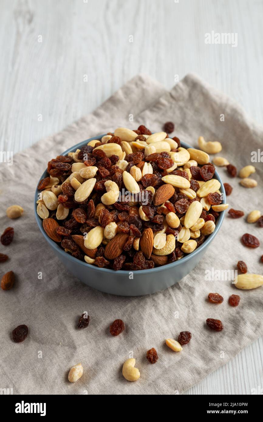 Raw Trail Mix with Nuts and Fruits in a Bowl, side view Stock Photo - Alamy