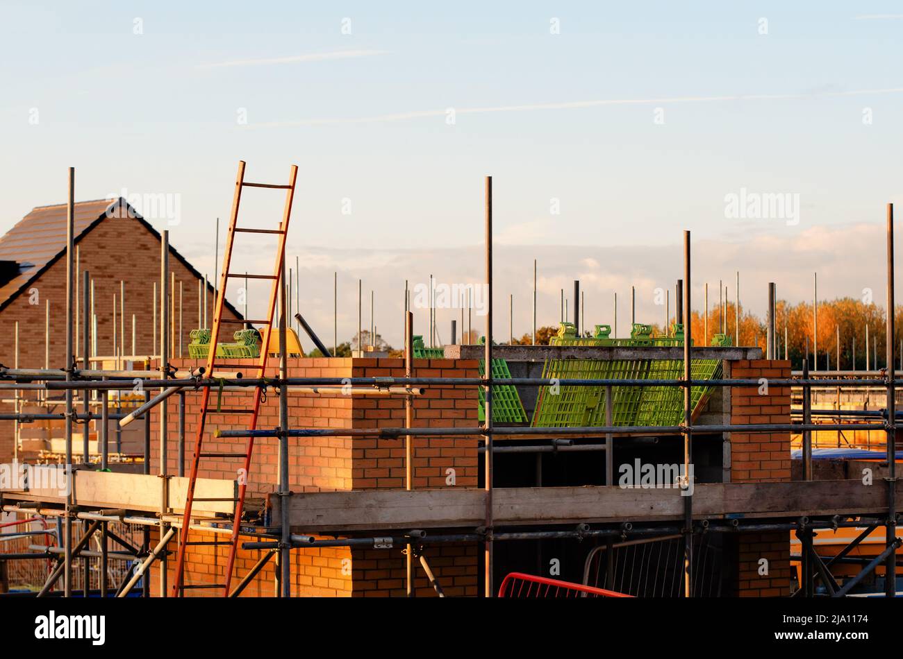 Scaffolds erected around brick walls to provide safe working platform ...