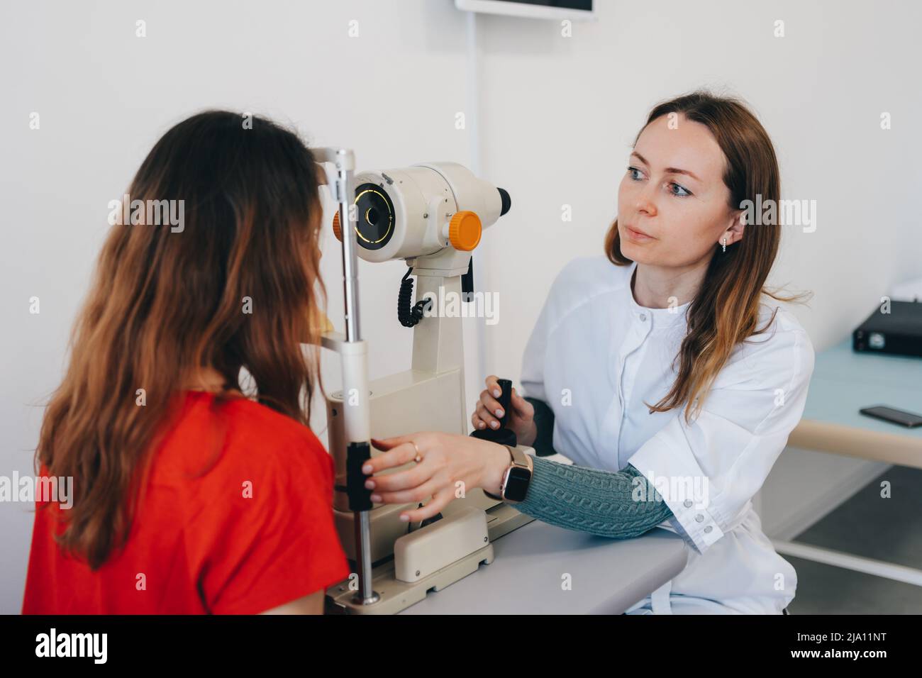 Eye test for visual acuity. The patient receives eye consultation Stock ...
