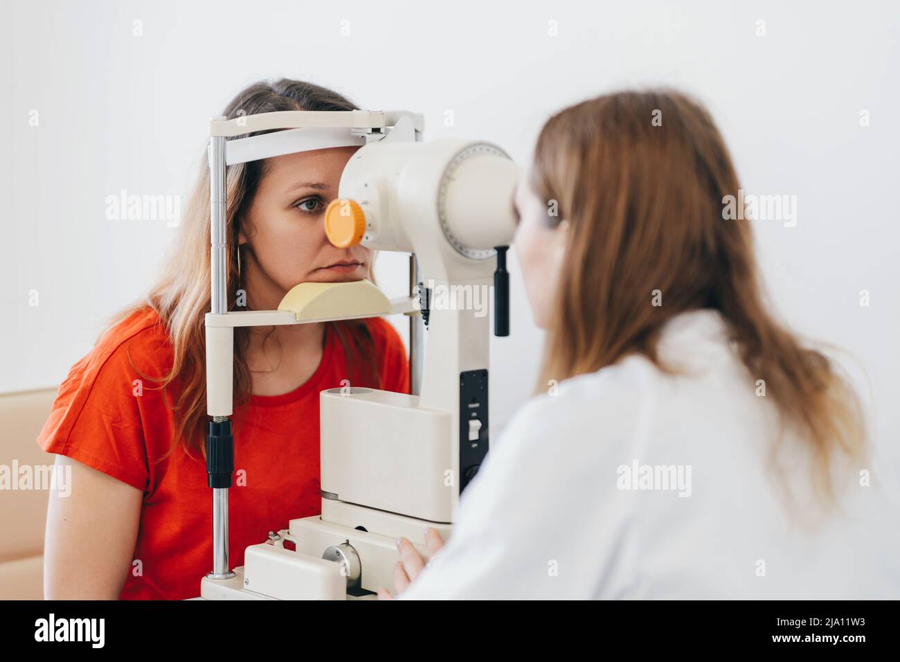 Eye test for visual acuity. The patient receives eye consultation Stock ...