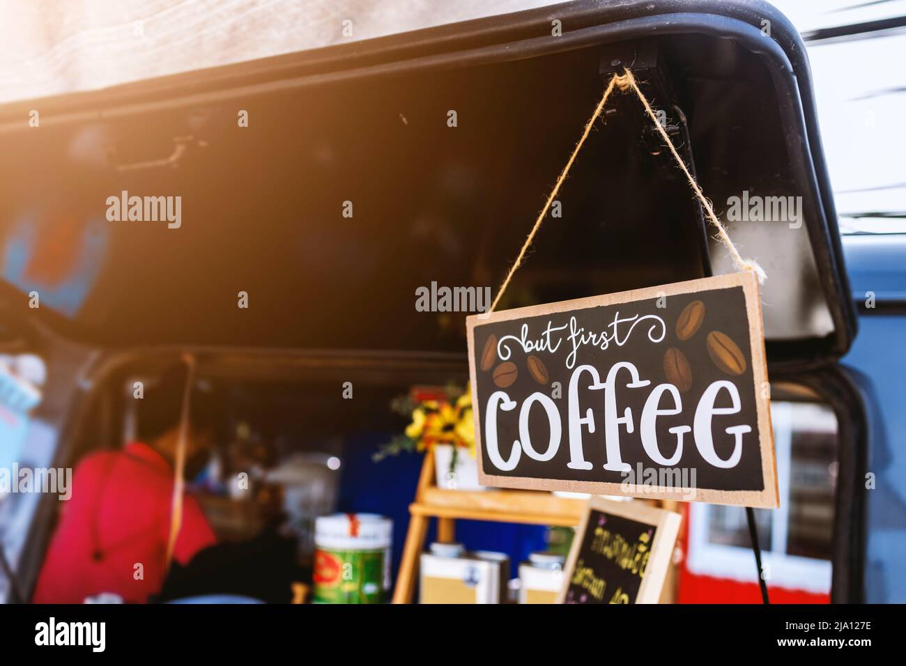 moka pot cafe. wooden sign at coffee truck with soft-focus and over ...