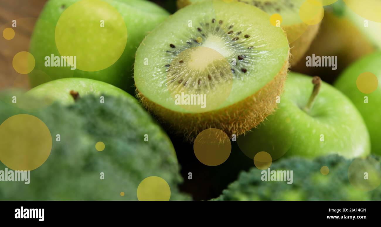Image of falling yellow spots over fruits Stock Photo - Alamy