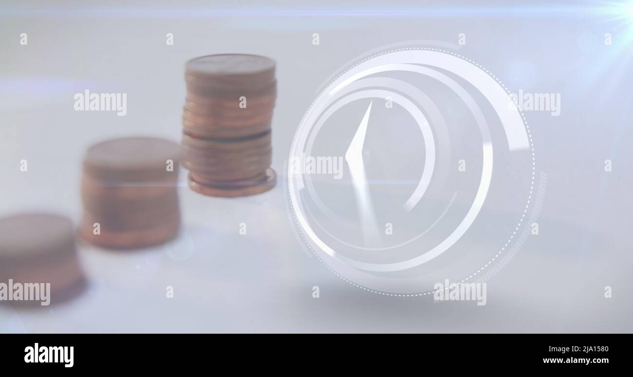 Image of clock over coins Stock Photo - Alamy