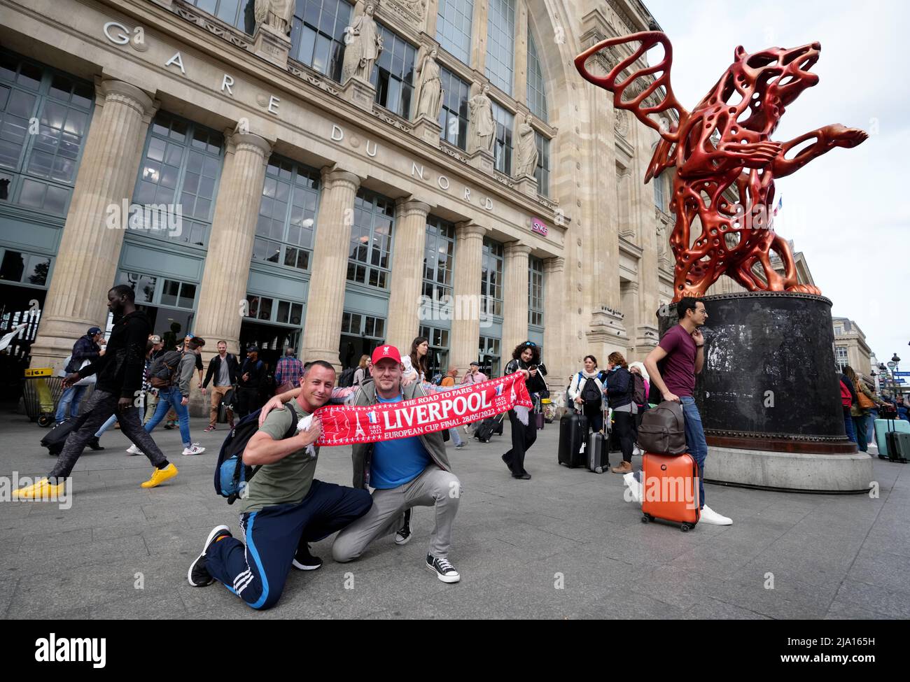 Liverpool fans pose for a photograph at Gare du Nord ahead of Saturday ...