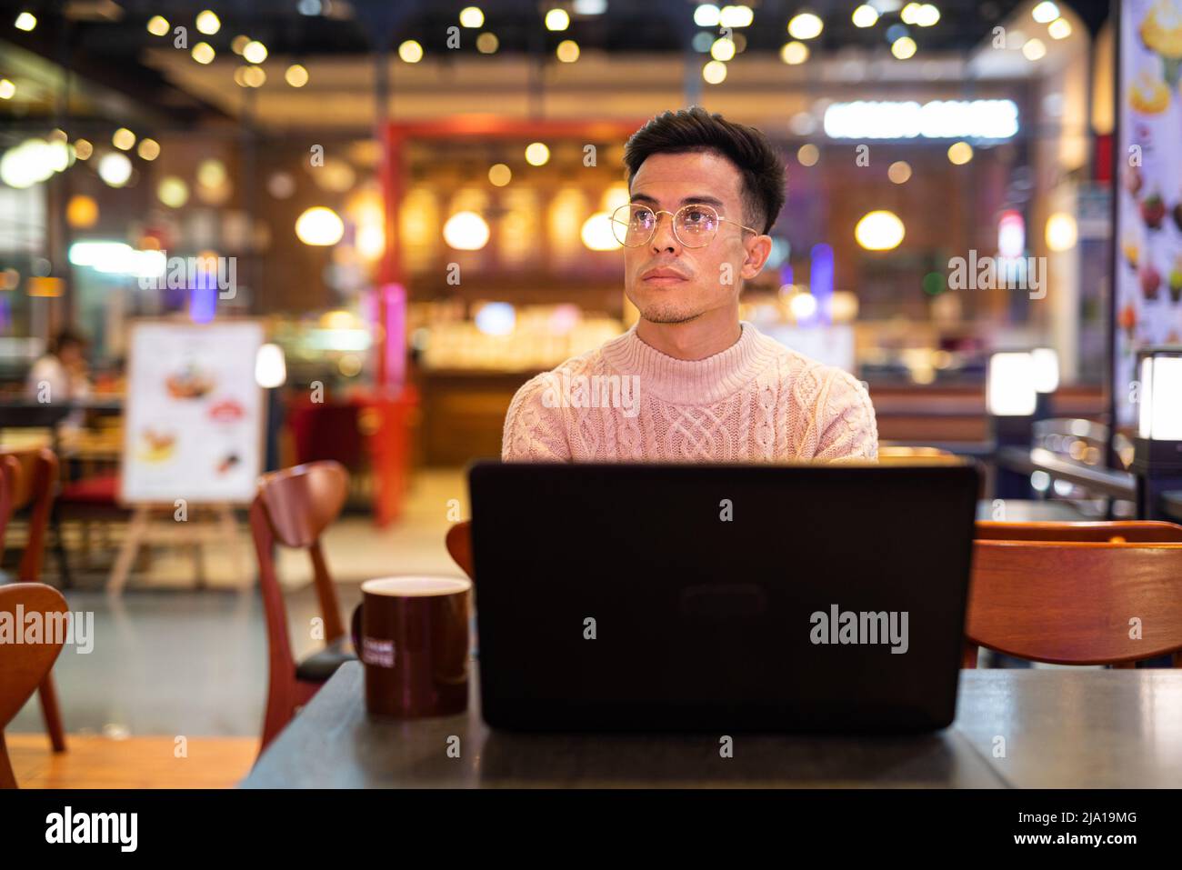 Cheerful guy using laptop typing hi-res stock photography and images ...