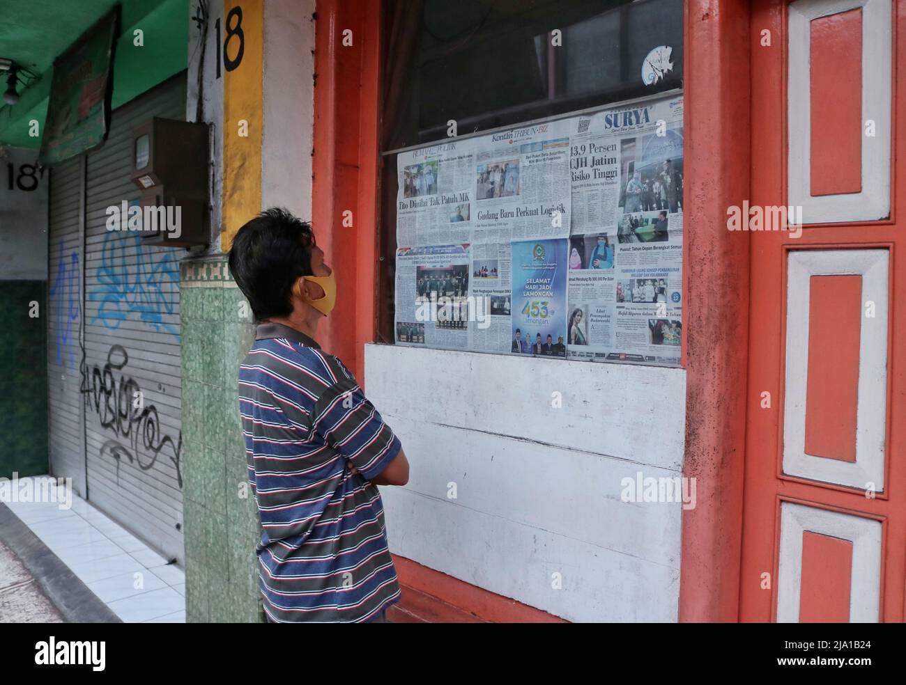 Malang, East Java, Indonesia. 26th May, 2022. A man reads a newspaper ...