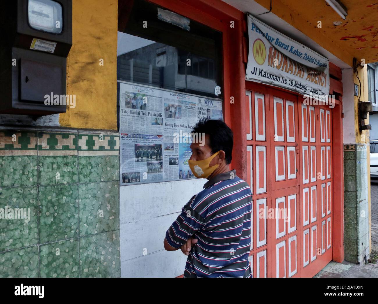 Malang, East Java, Indonesia. 26th May, 2022. A man reads a newspaper ...