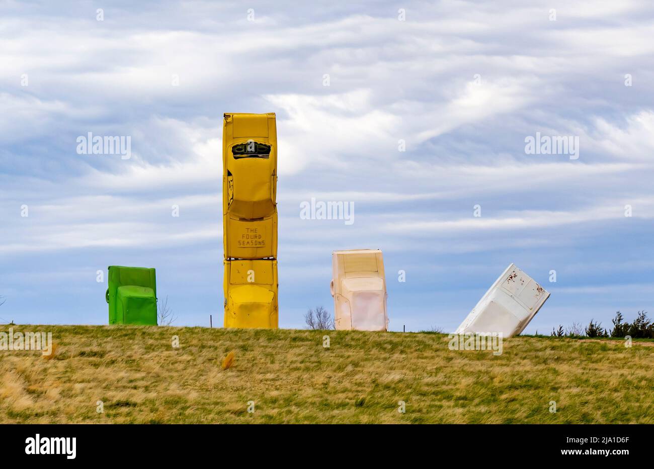Old cars buried in the ground as an art installion at Carhenge in ...