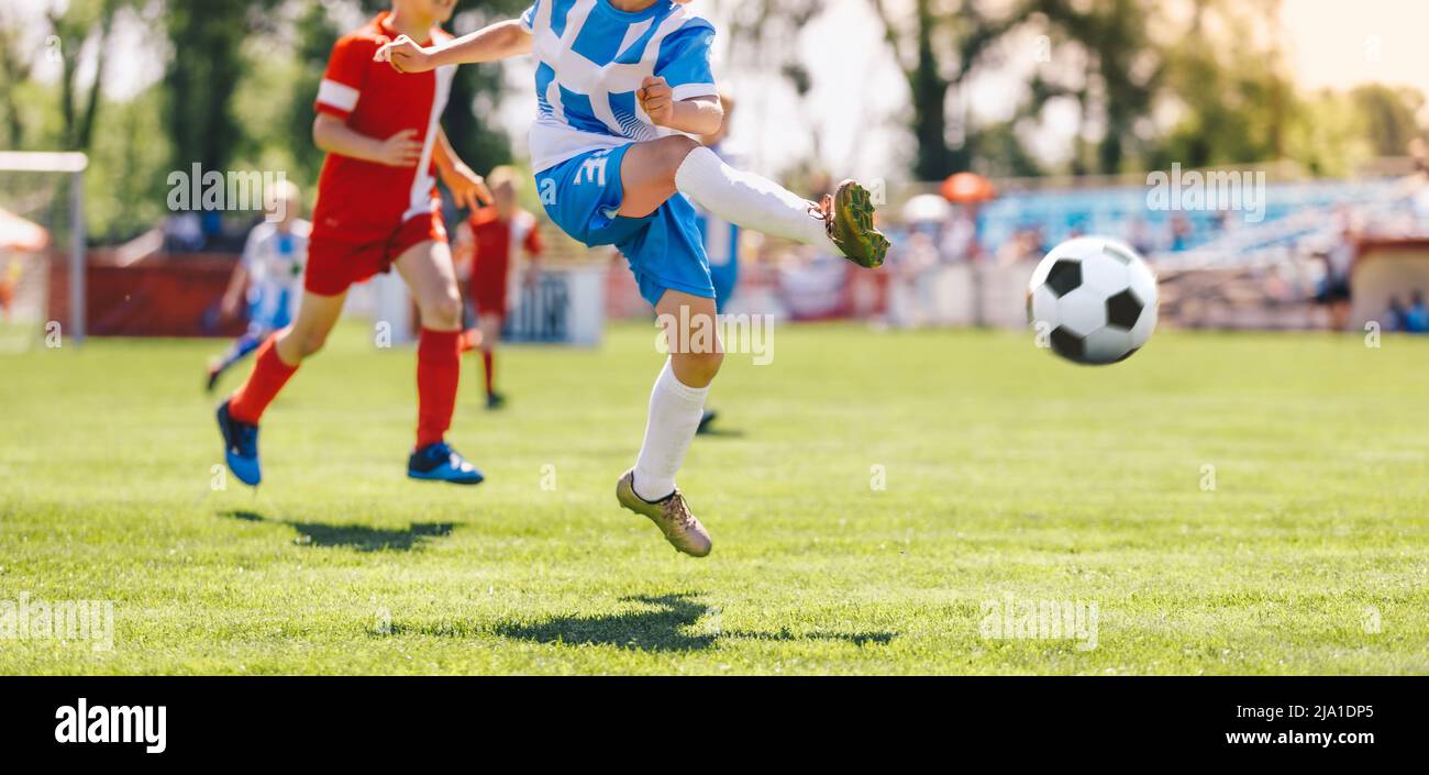 Boy Kick Soccer Ball Towards Goal and Try to Score a Goal. Kids Playing ...