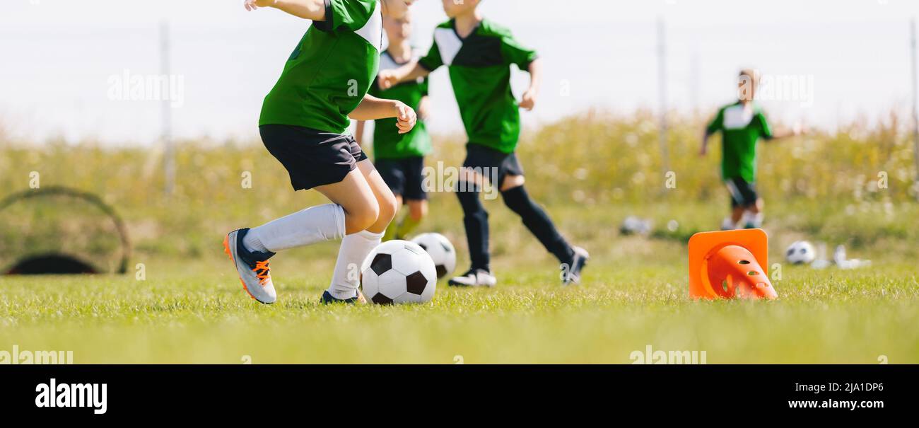 Kids attending soccer training on school field. Children play together ...