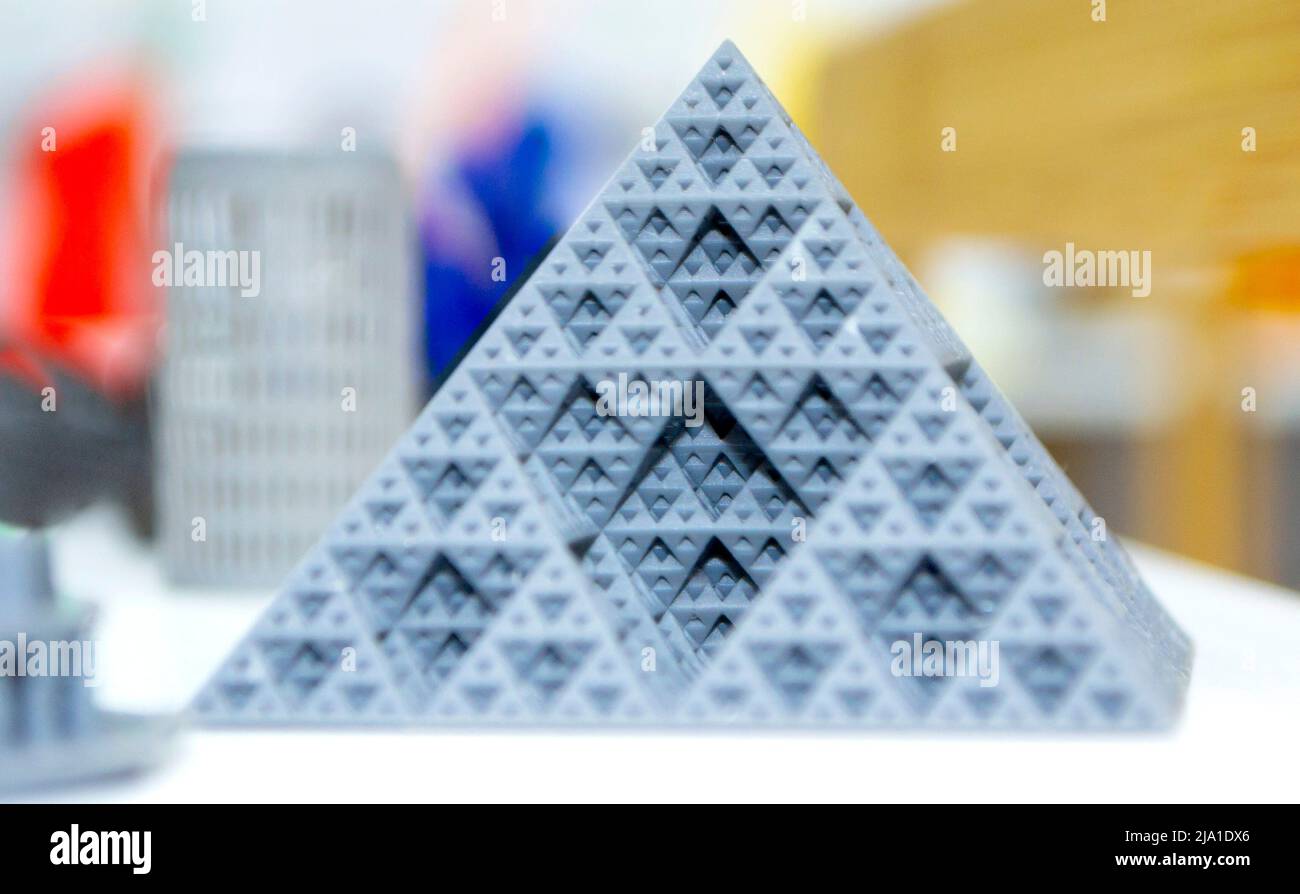 Abstract model pyramid printed on 3d printer. Object photopolymer ...