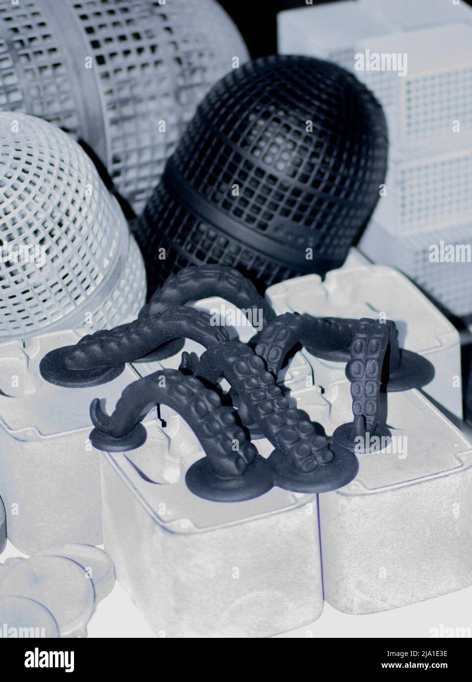 Many different models printed on 3D printer. Gray and black objects ...