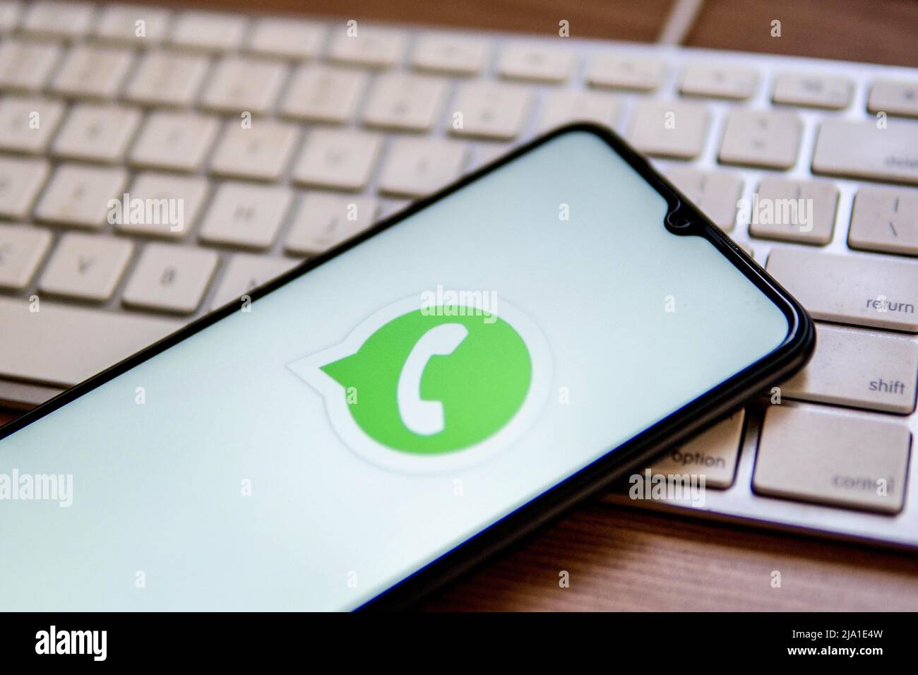 In this photo illustration, a WhatsApp logo seen displayed on a ...
