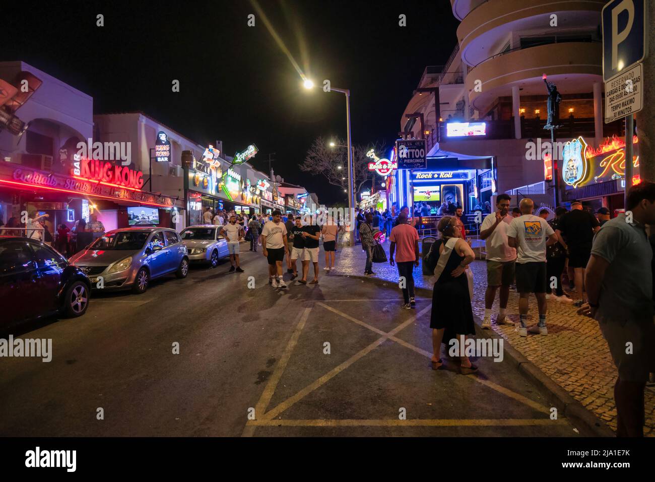 Crowds enjoying the vibrant nightlife along The Strip in Albufeira ...