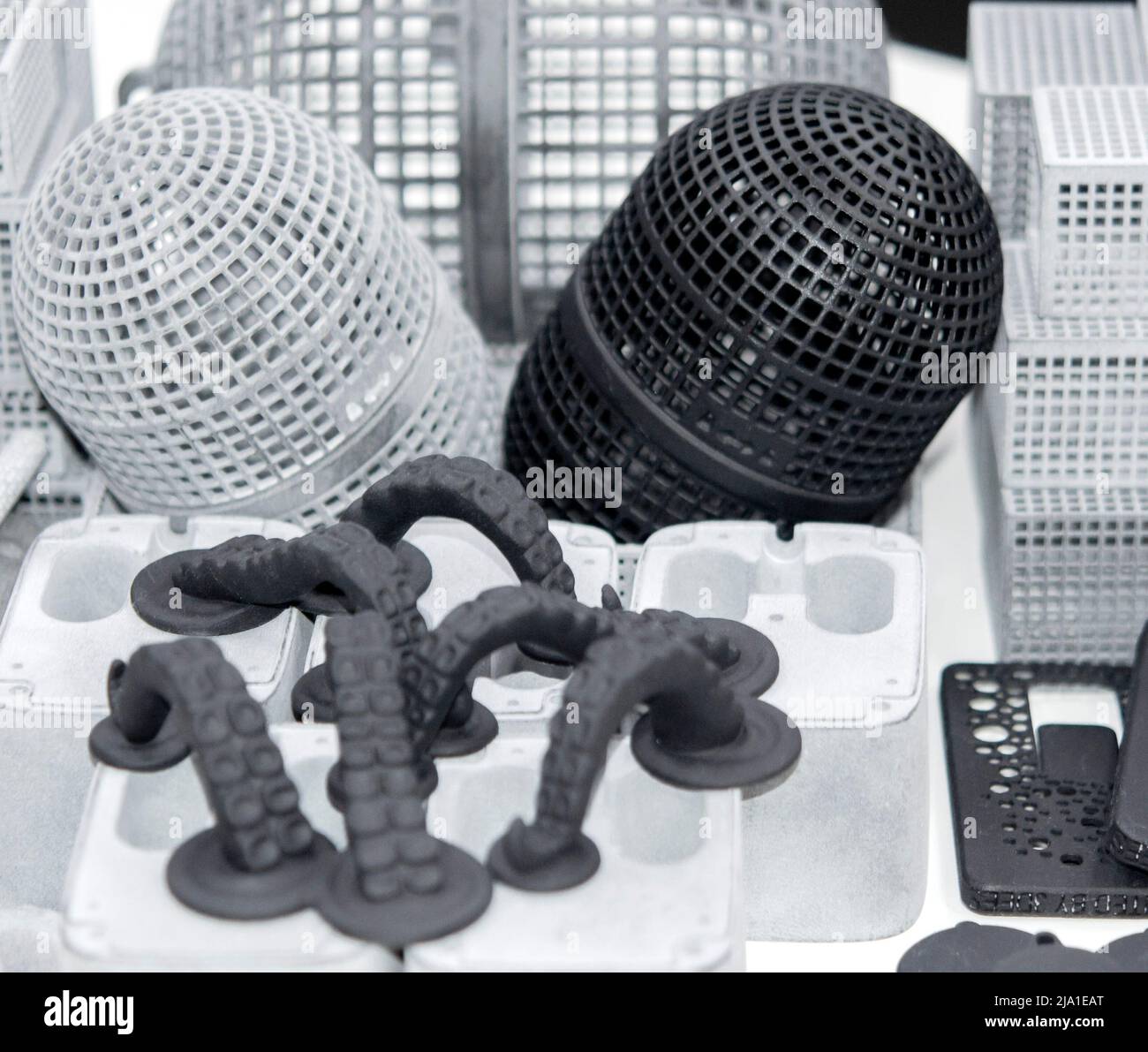 Many different models printed on 3D printer. Gray and black objects ...