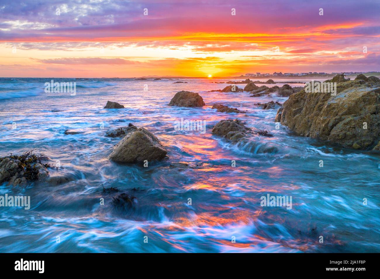 The sunset at Rhosneigr on Anglesey, Wales Stock Photo - Alamy