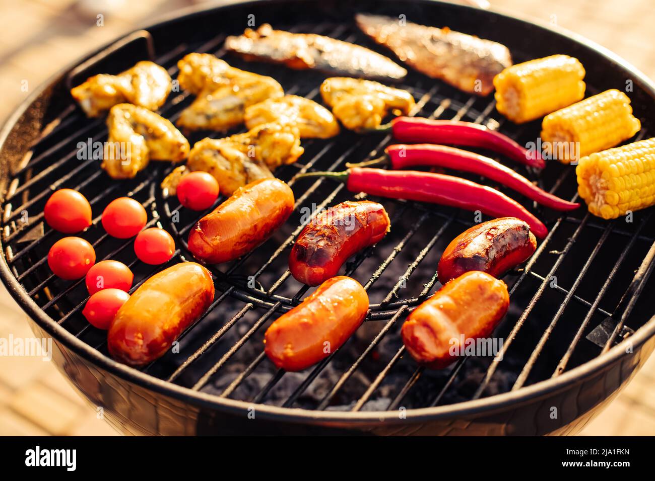 Assortment of delicious grilled meat and sausages with grilled ...