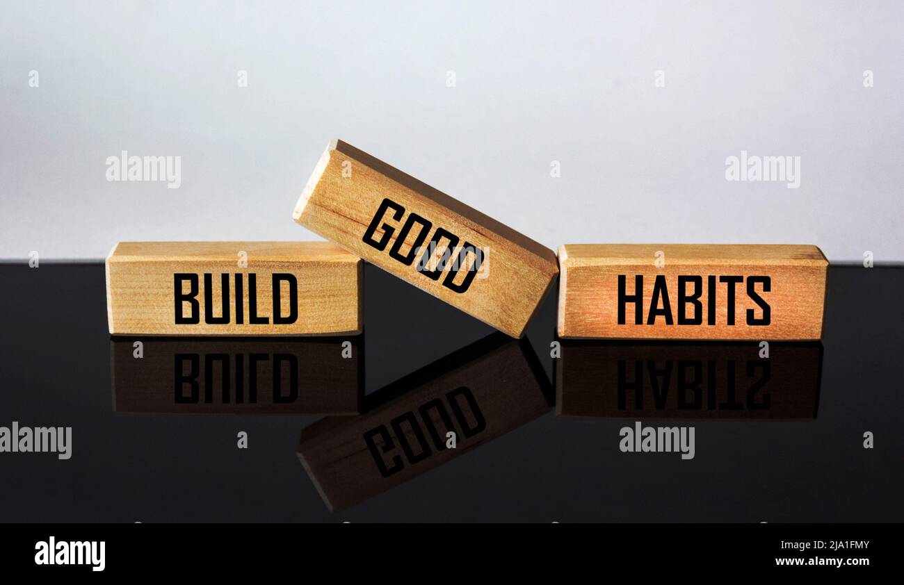 Symbol of good habits. Wooden blocks with the words Create good habits ...