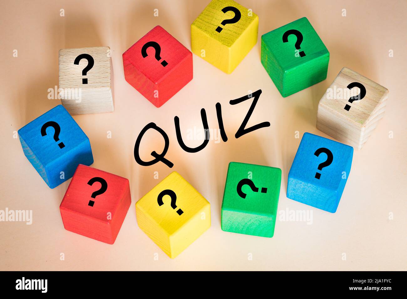 The inscription Quiz on wooden blocks other blocks with question marks ...