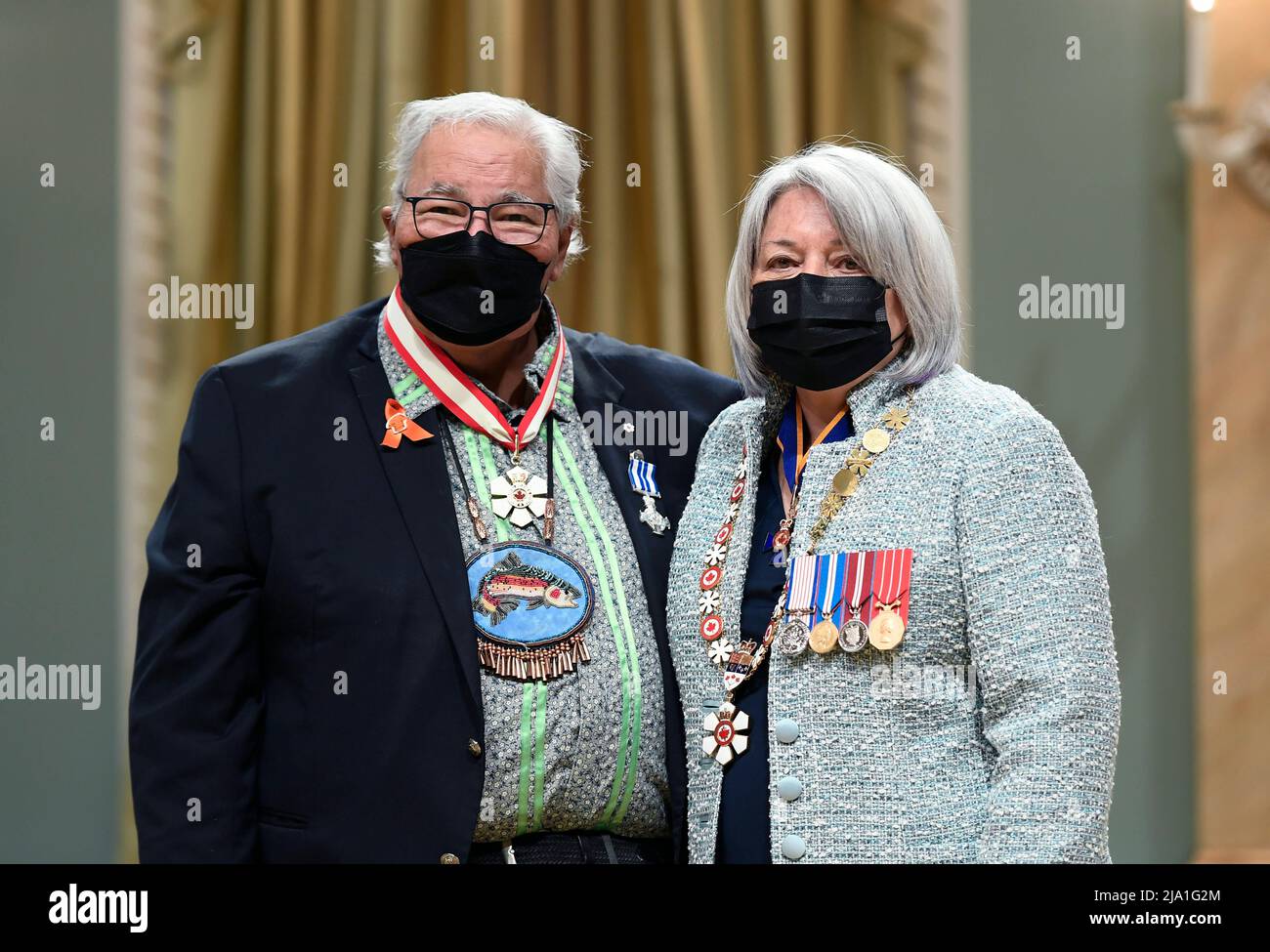 Justice Murray Sinclair stands with Gov. Gen. Mary Simon after being invested as a companion of ...