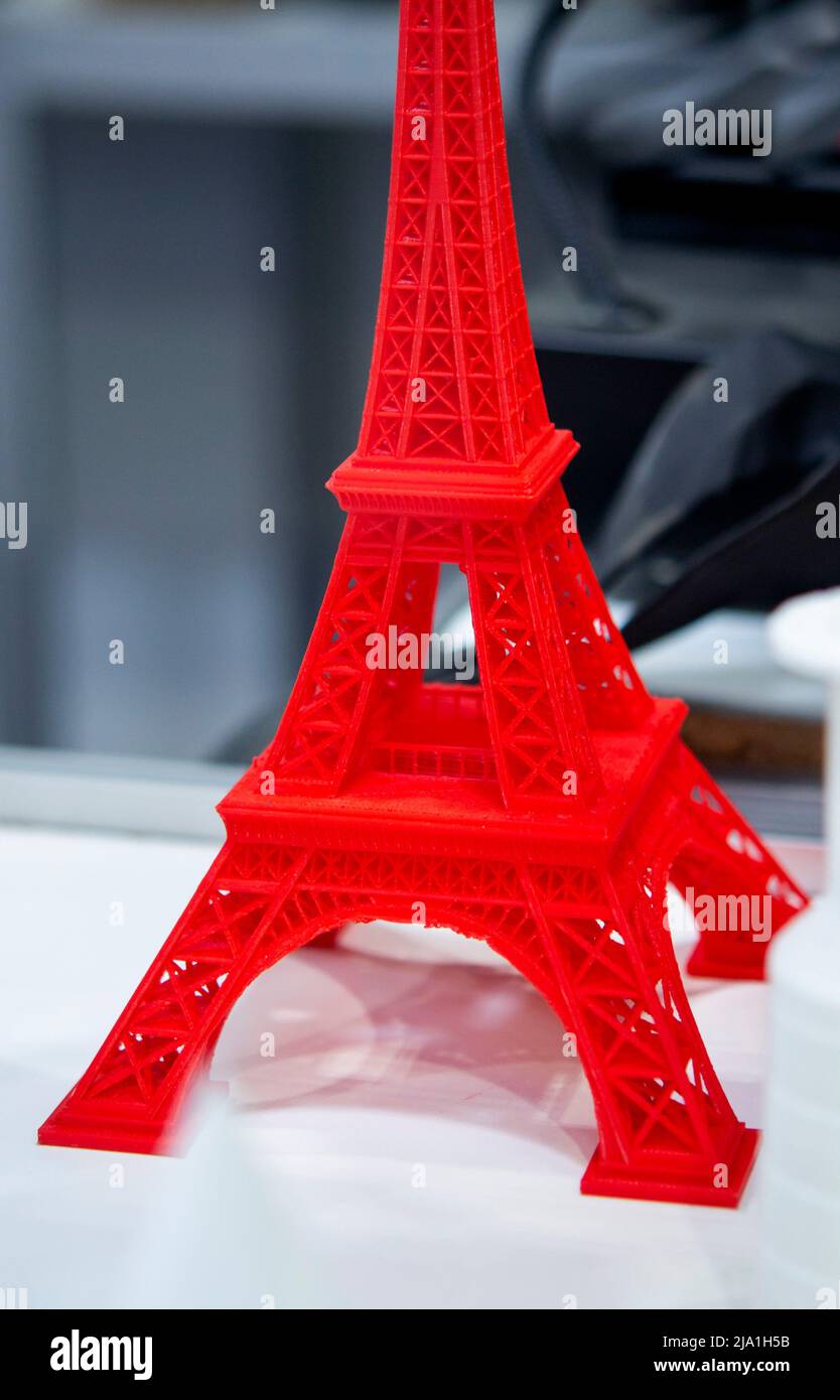 Red model printed on 3D printer from plastic close-up. New progressive ...